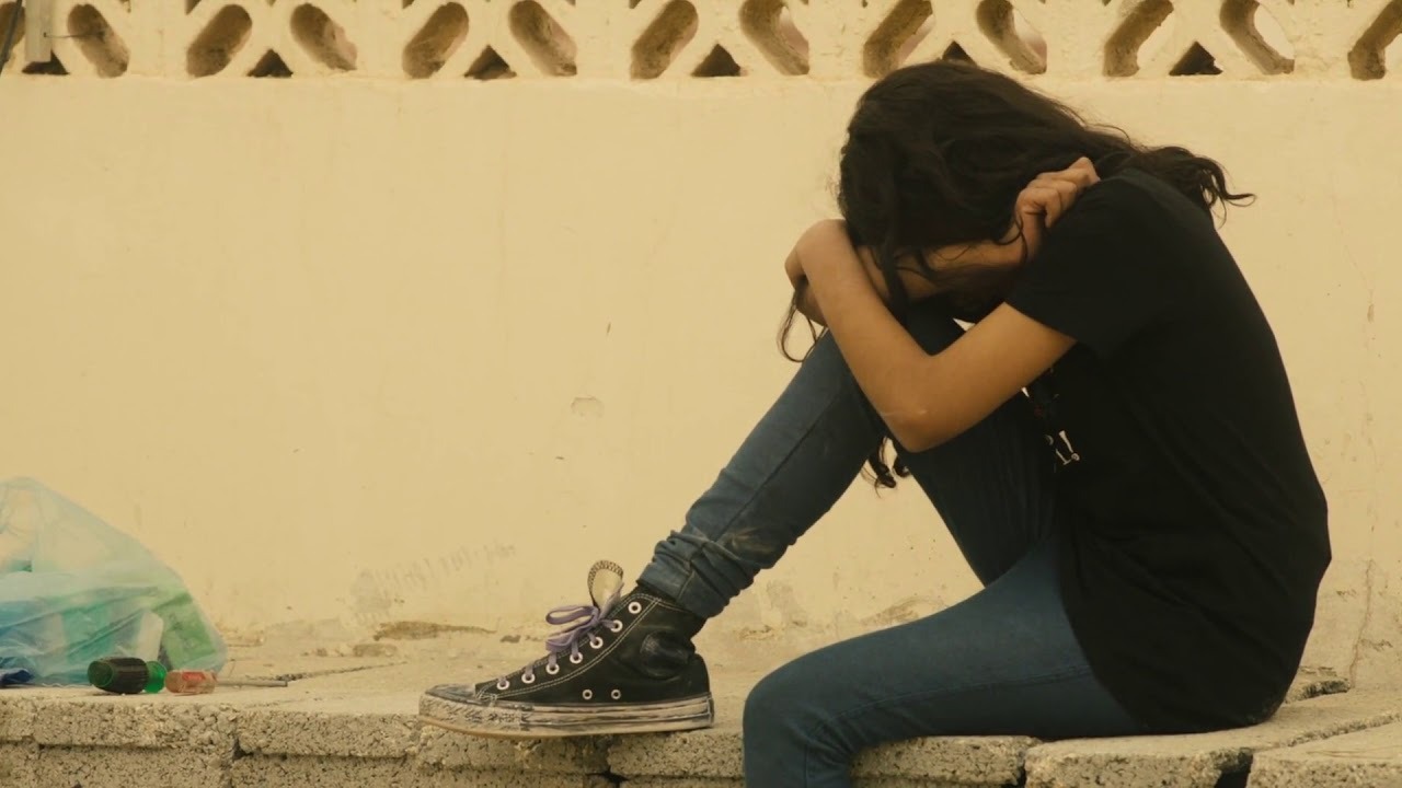 Wadjda crying after her mother finds out she was riding her friend’s bike.